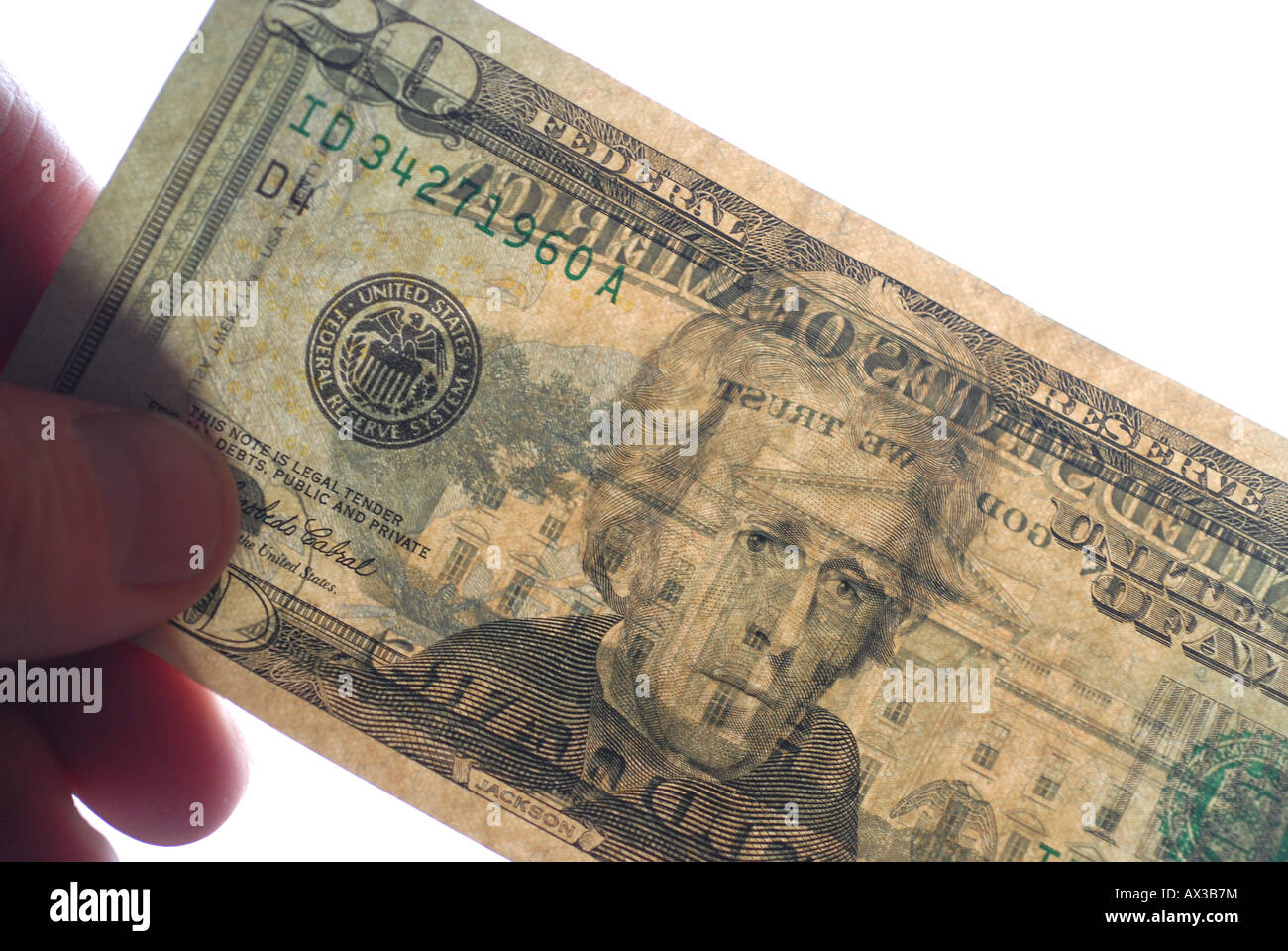 Closeup of new American twenty dollar bill (backlit to show watermarks ...