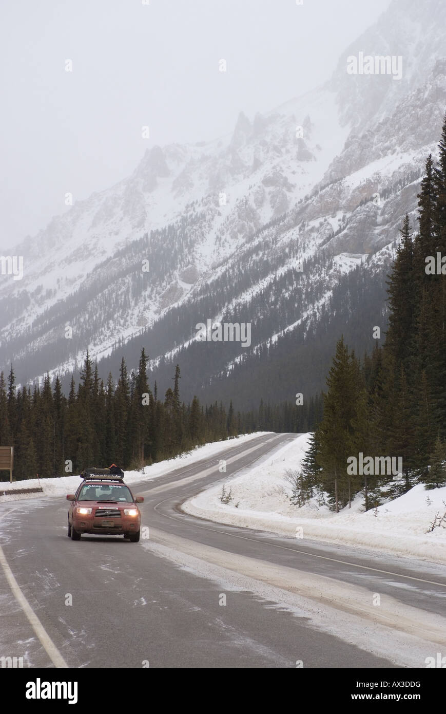 CANADA Alberta Banff Banff National Park Car drives in snowy conditions ...