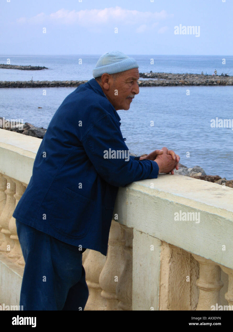 Old man watching sea, Bou Ismail fishing port, west of Algiers town ...