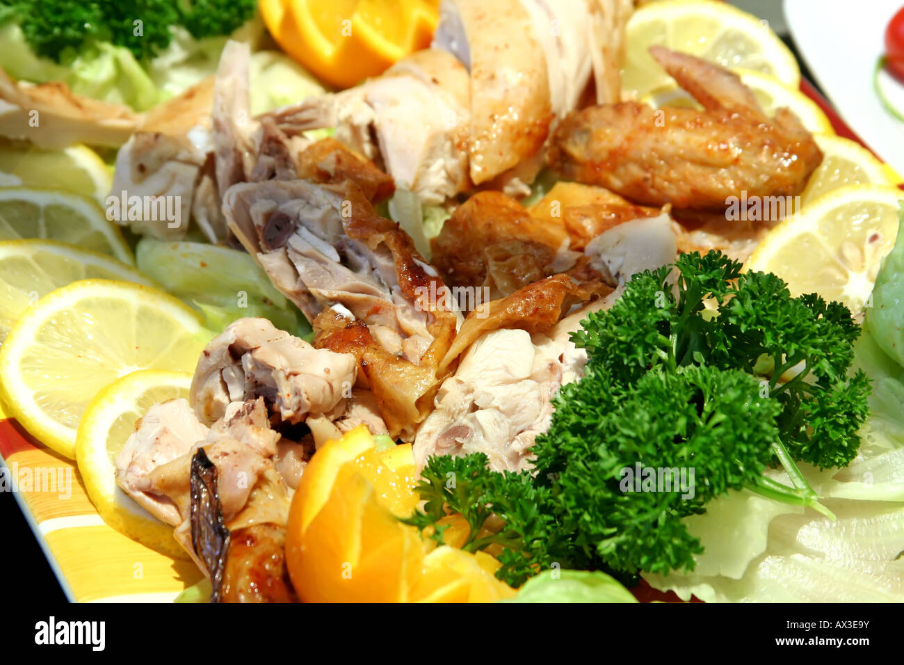 Chopped roast chicken parts in restaurant presentation Stock Photo - Alamy