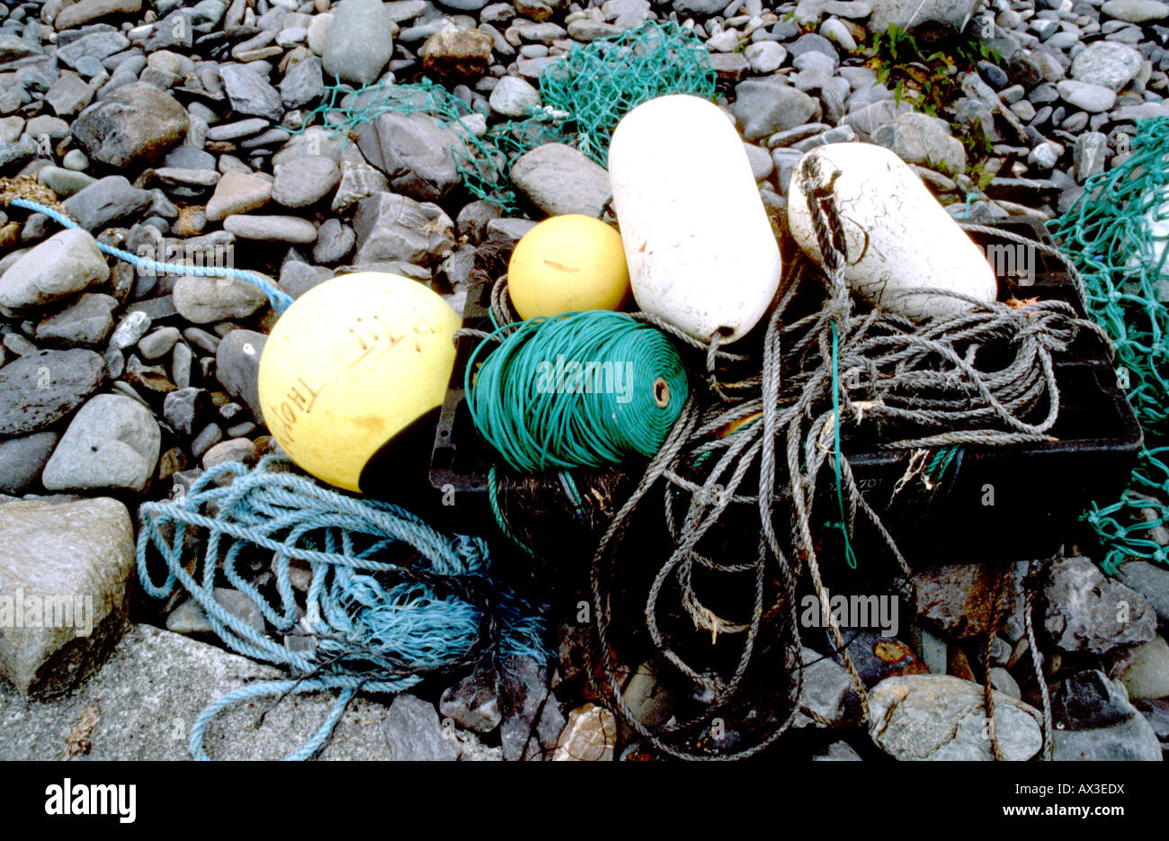 Fishing floats & lines on shore Stock Photo - Alamy