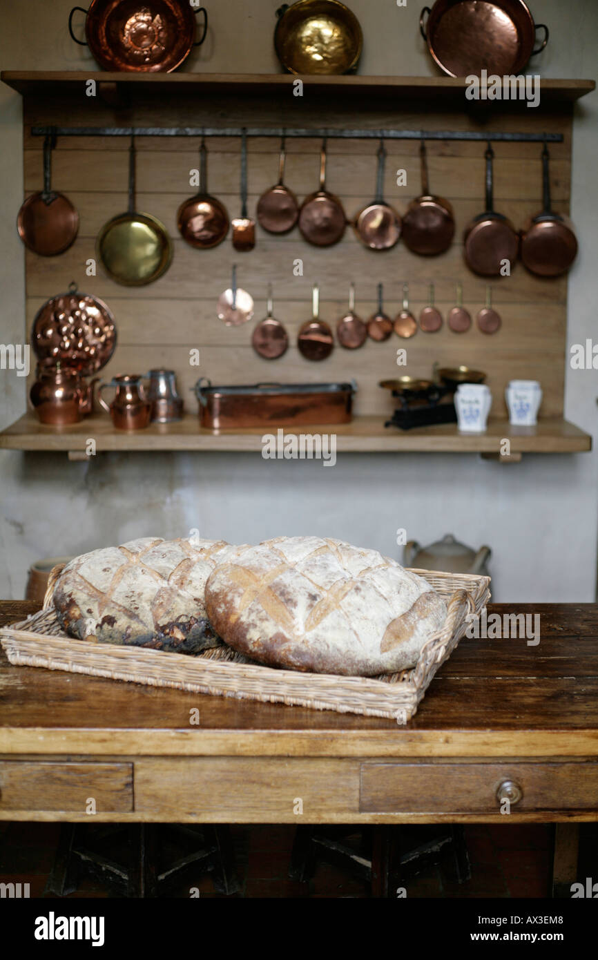 Rustic loaf bread and copper pans in french kitchenVillandry Chateau ...
