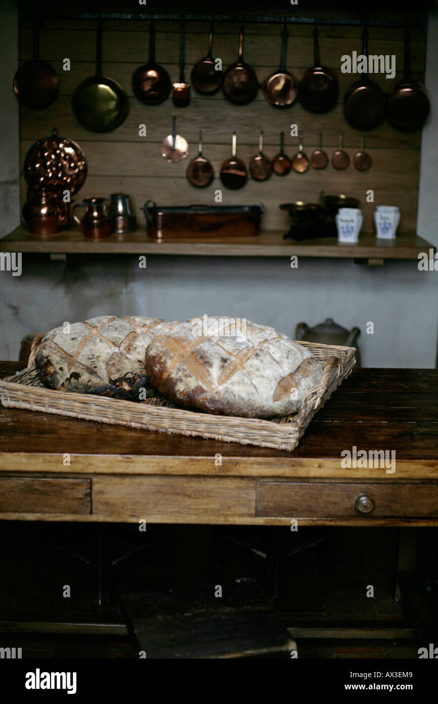 Rustic loaf bread and copper pans in french kitchenVillandry Chateau ...
