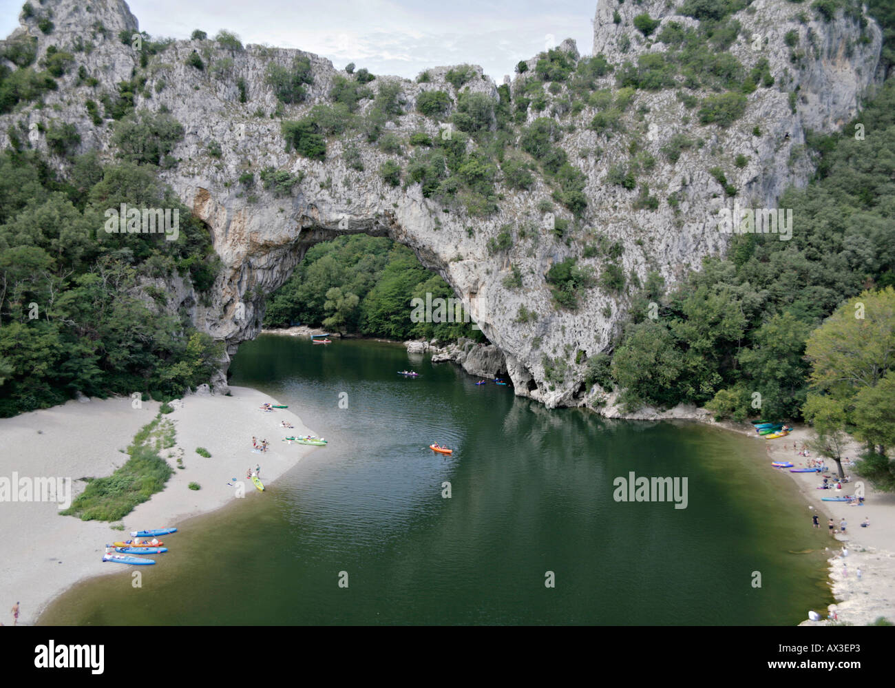 Canoe kayak and canoeist Pont d'Arc natural stone rock arch Ardeche ...