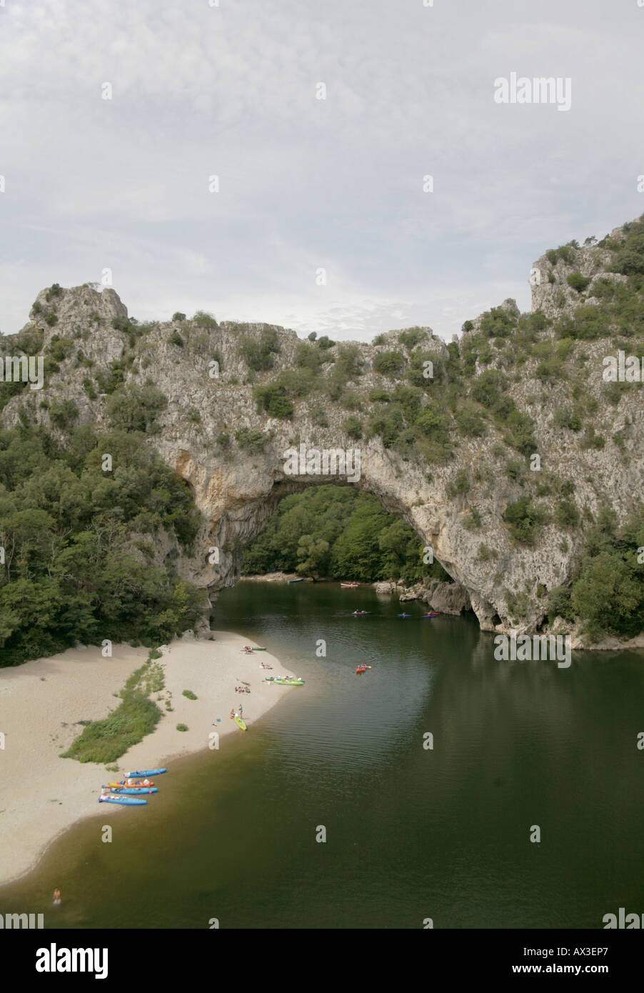 Canoe kayak and canoeist Pont d'Arc natural stone rock arch Ardeche ...