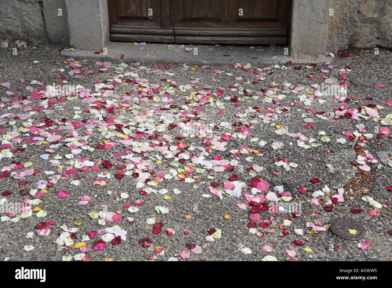 confetti in shape of rose petals outside doorway of French church in ...
