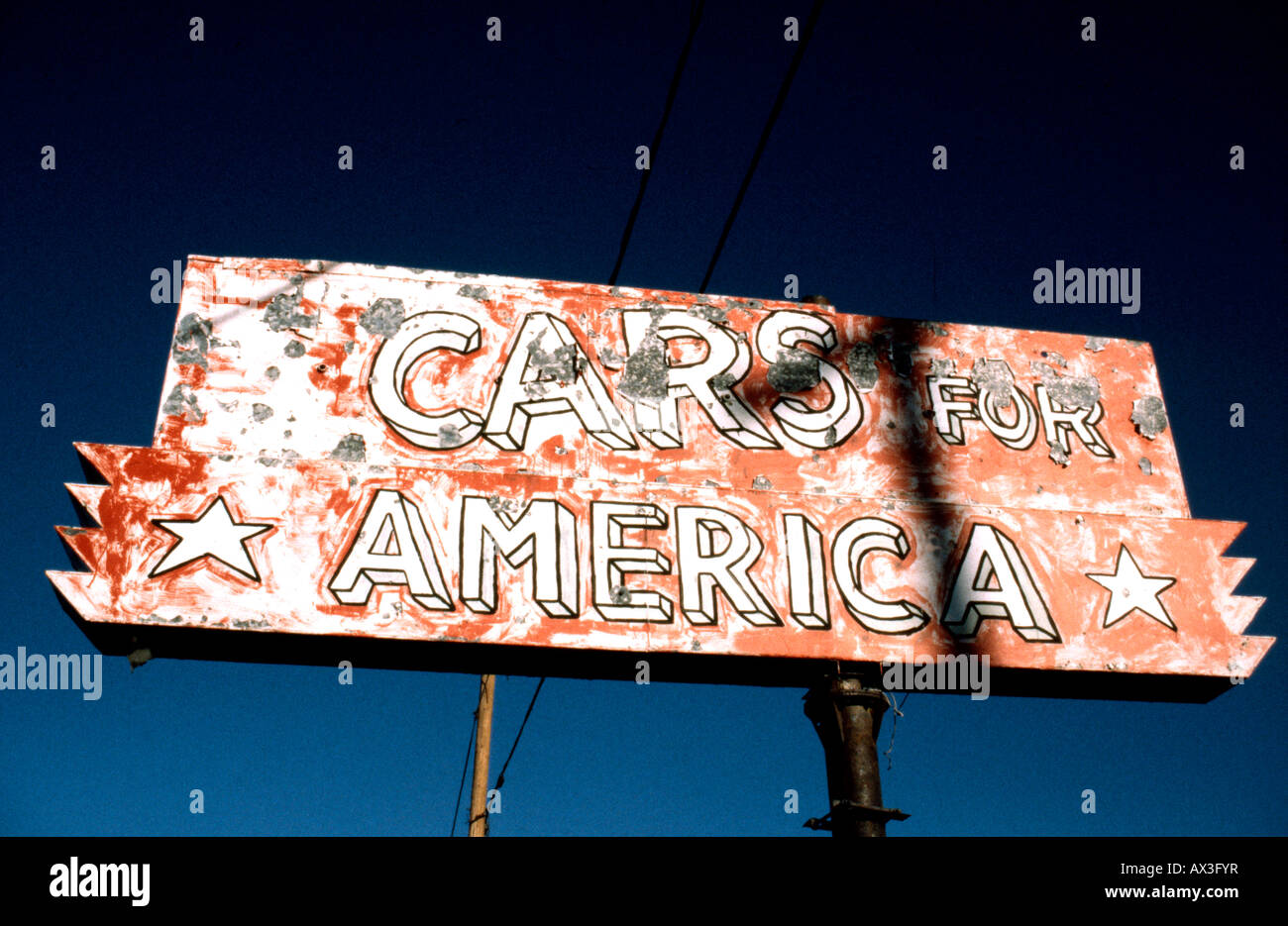 Old car dealership sign in USA Stock Photo - Alamy