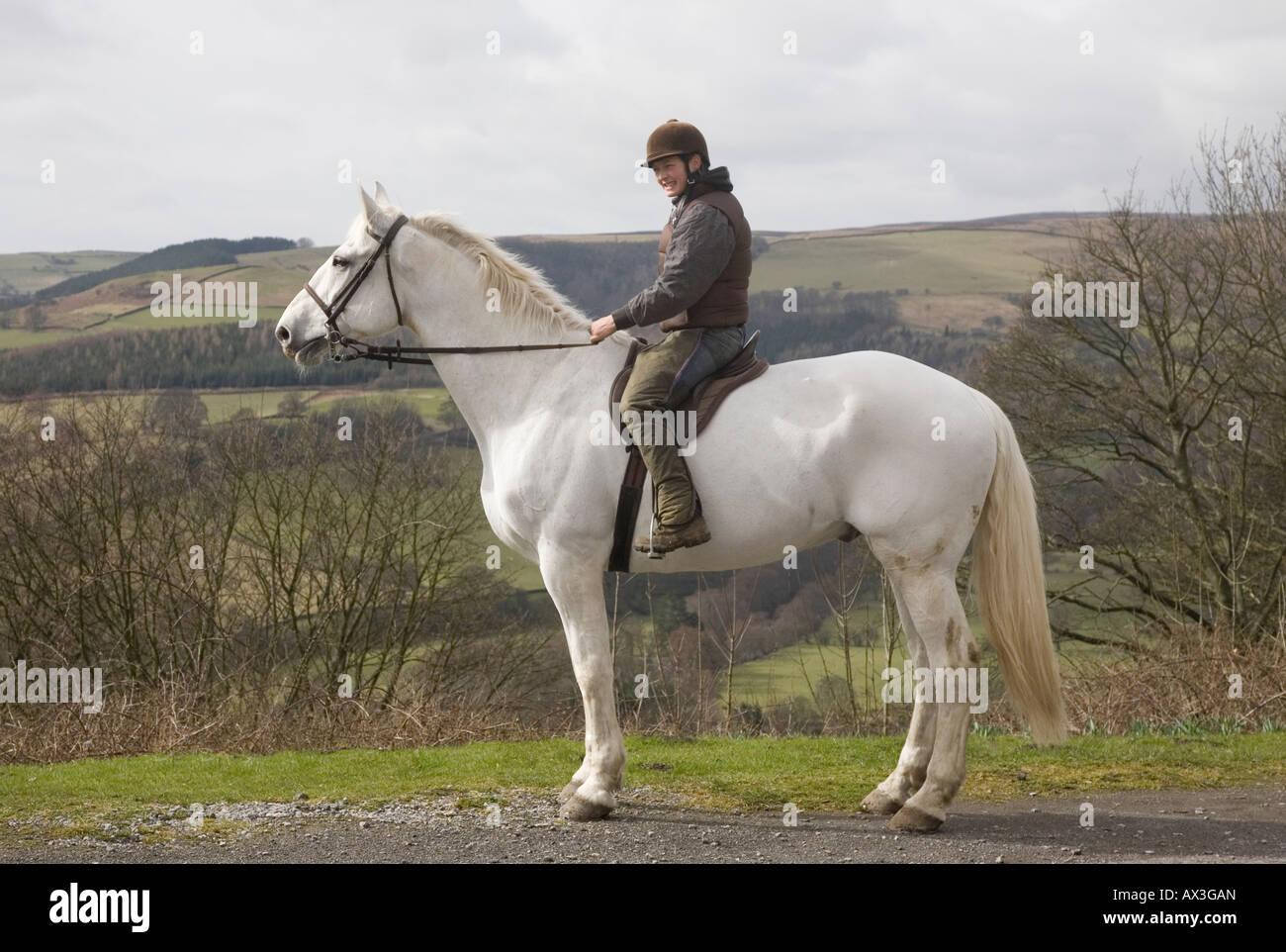 Riding a White Horse; mounted female horse leisure rider in Hathersage ...