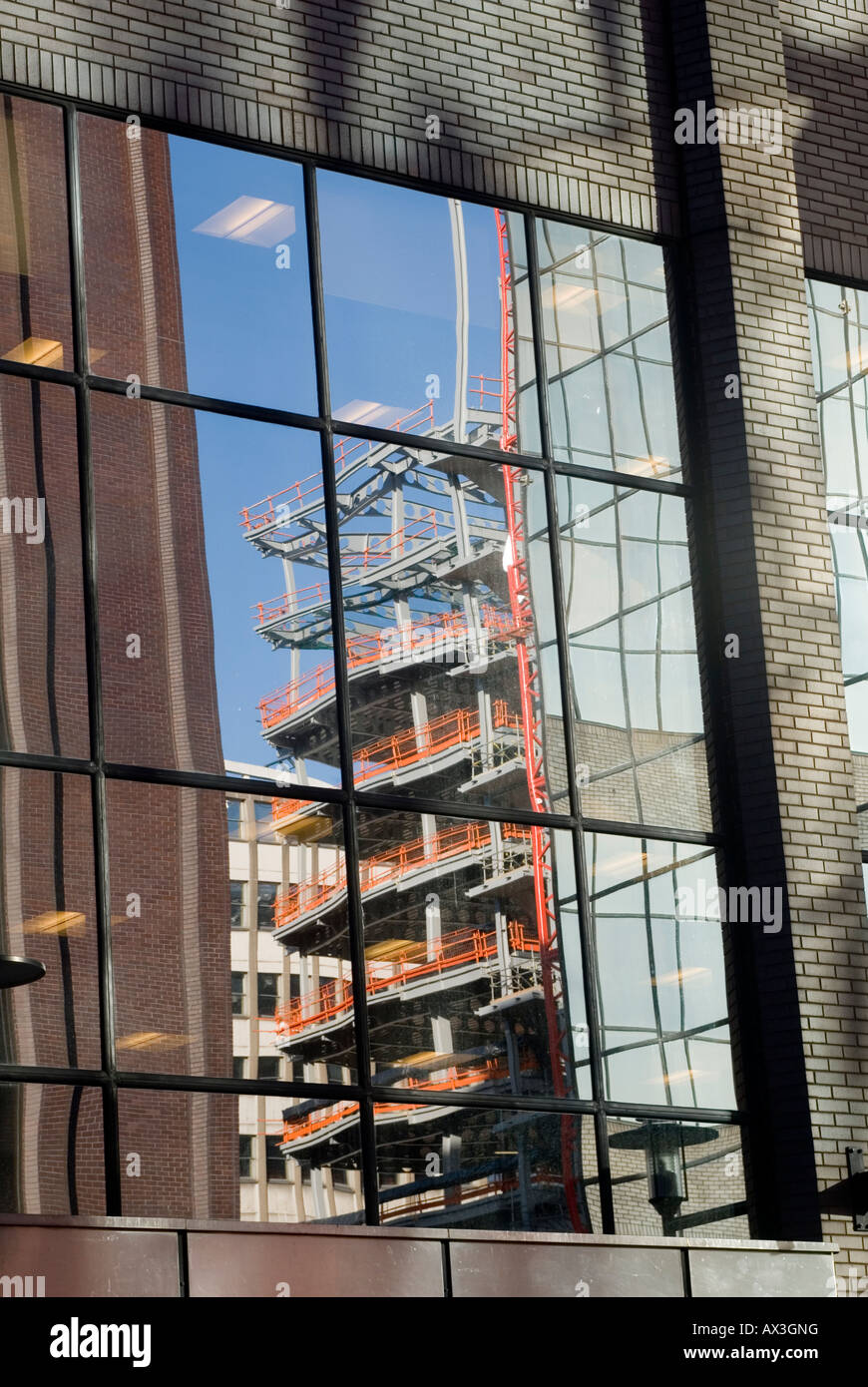 reflection of flats under construction on a building site in snow hill ...