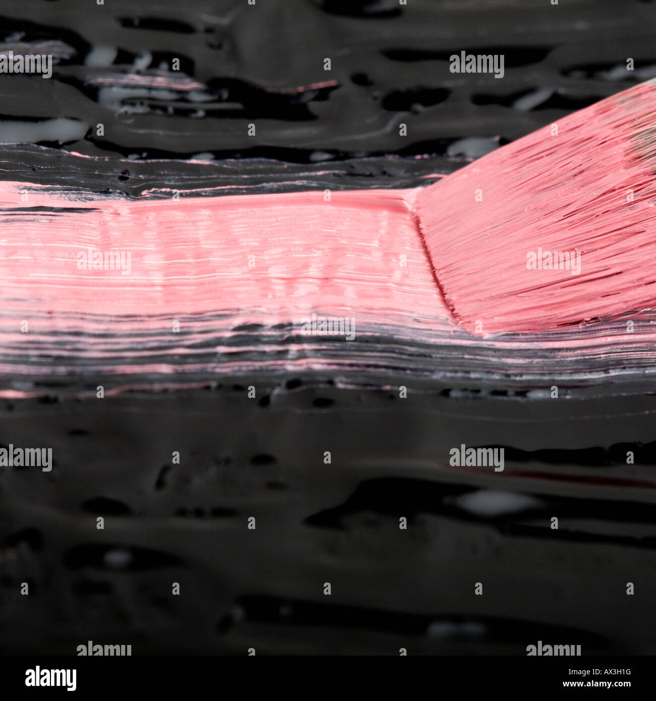 brush stroke of pink oil paint on black Stock Photo - Alamy