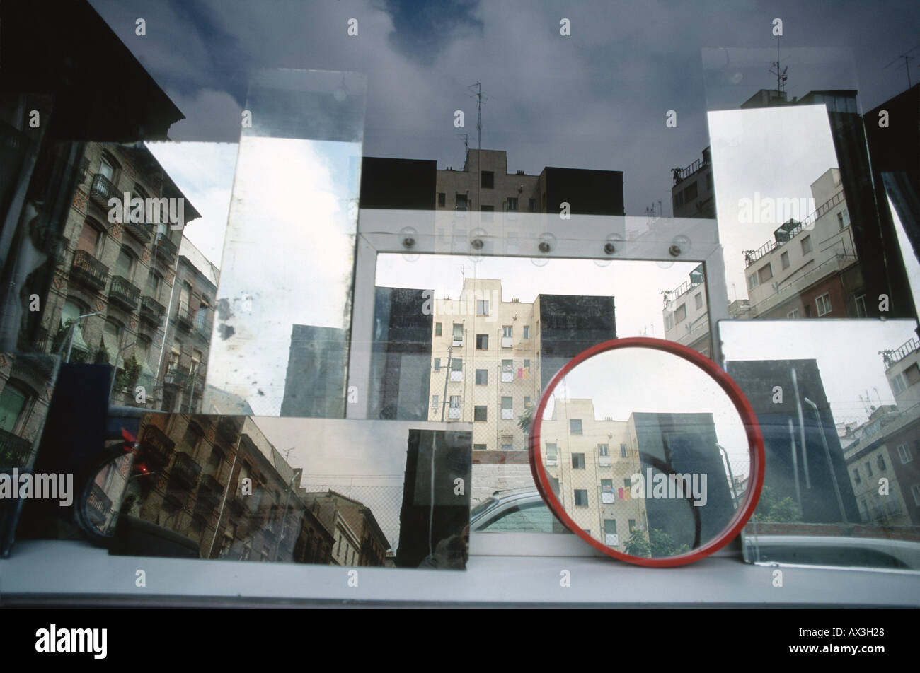 Street abstraction of mirror display in commercial street window ...