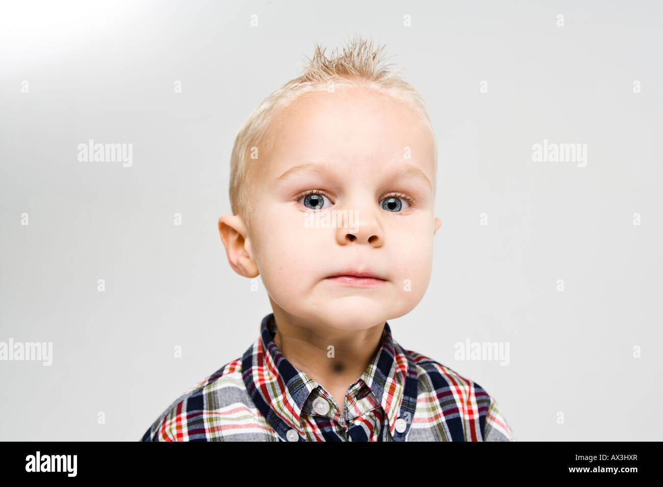 Small boy pulling grimace face Stock Photo - Alamy