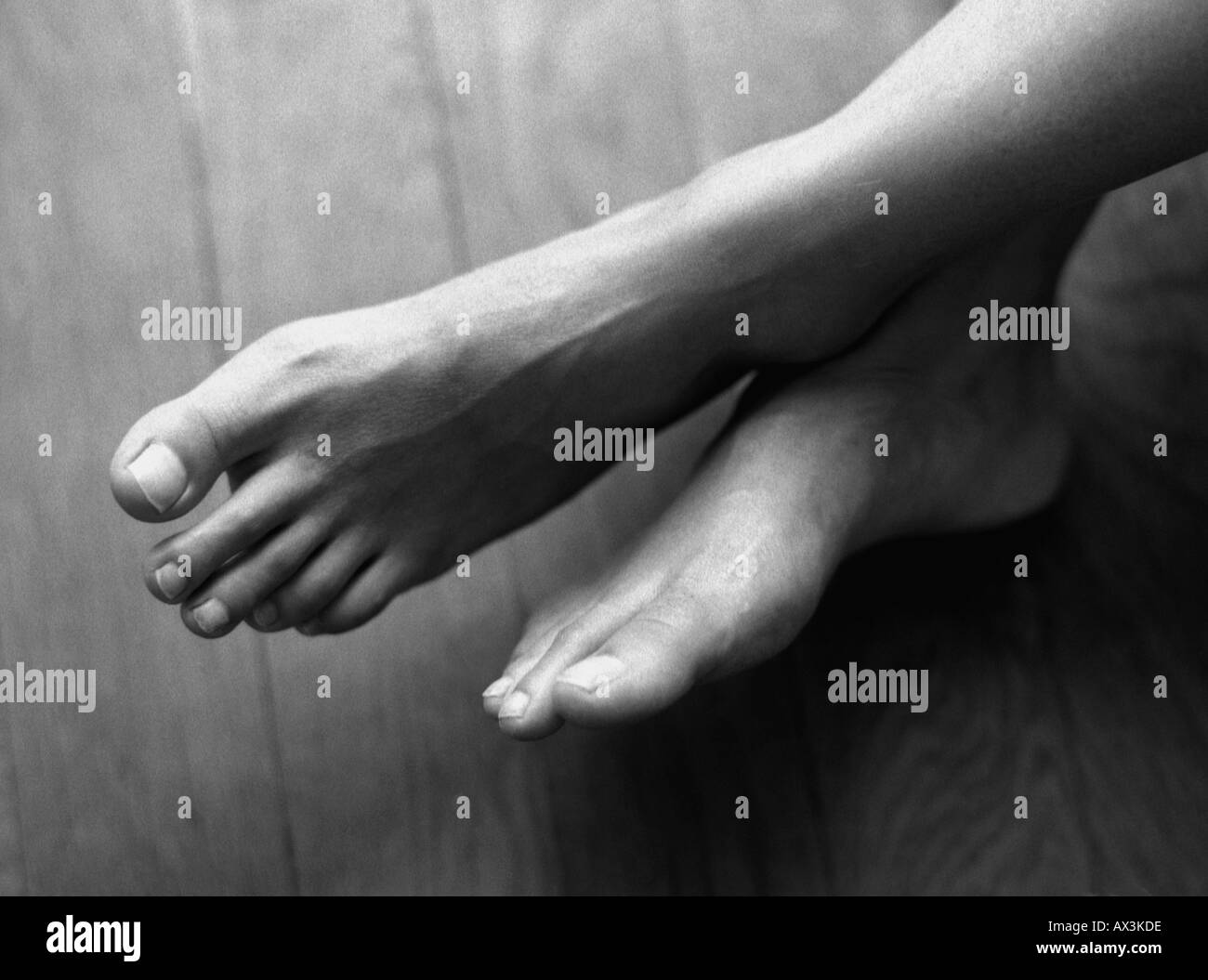 Woman Feet on a wood floor Stock Photo - Alamy