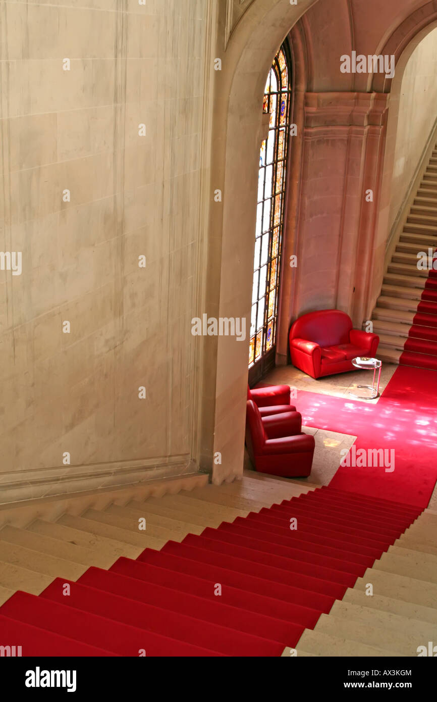 Sofas in waiting area with stained glass window Stock Photo - Alamy