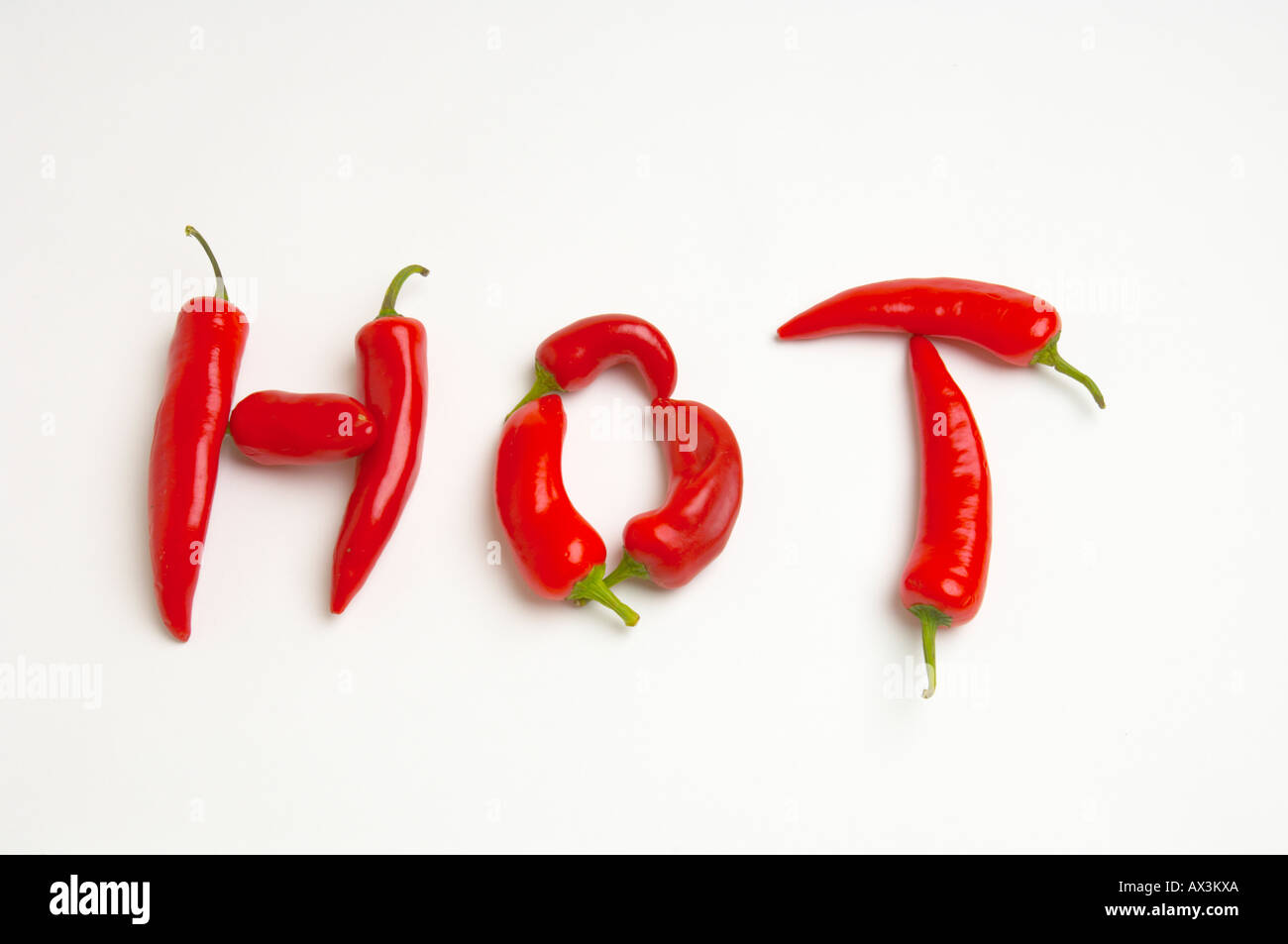 Red chili peppers spell out words relating to their taste Stock Photo ...