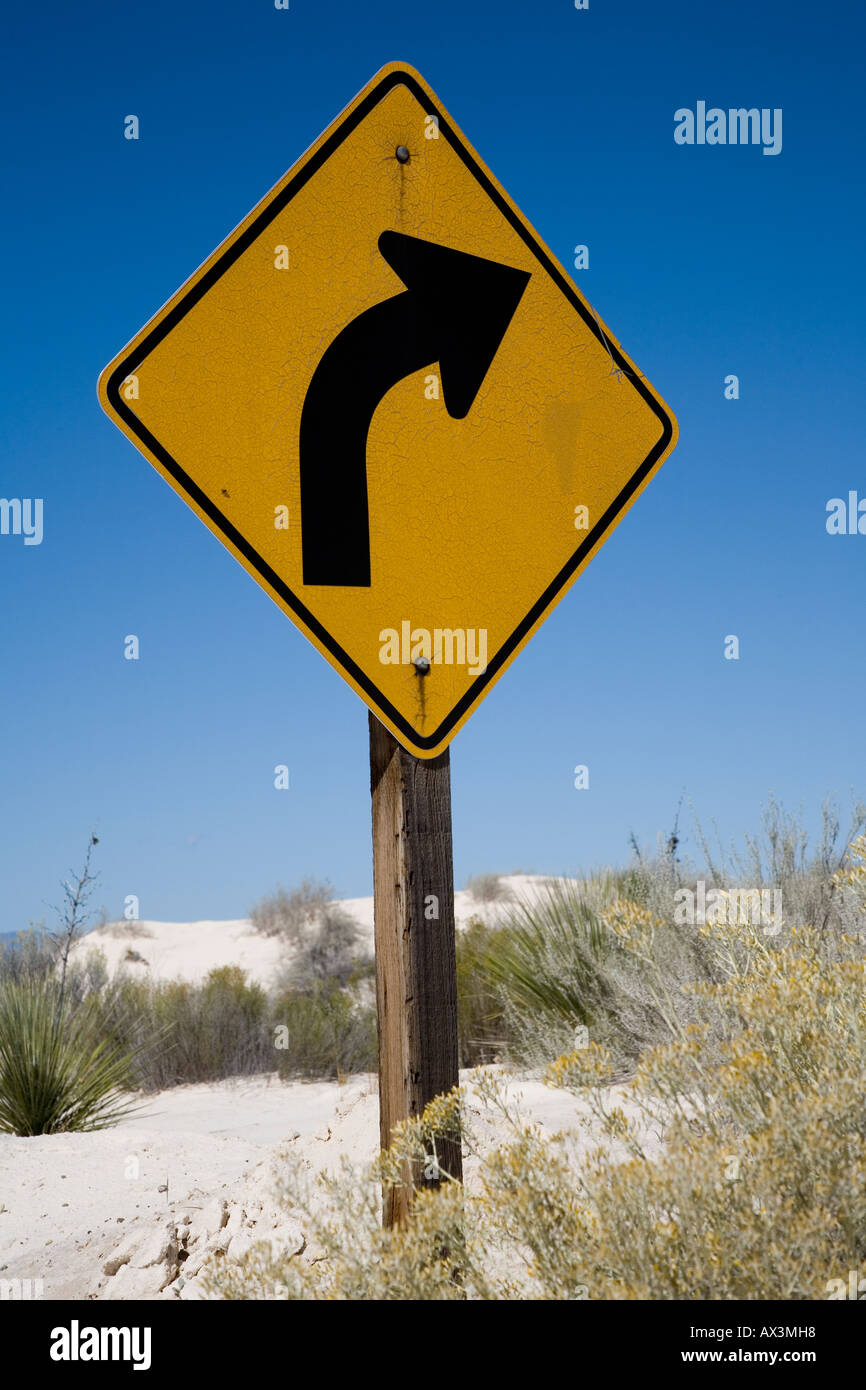 Traffic direction sign warning of bend usa Stock Photo - Alamy
