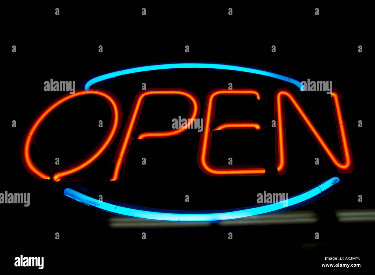 Neon open sign against black background Stock Photo - Alamy