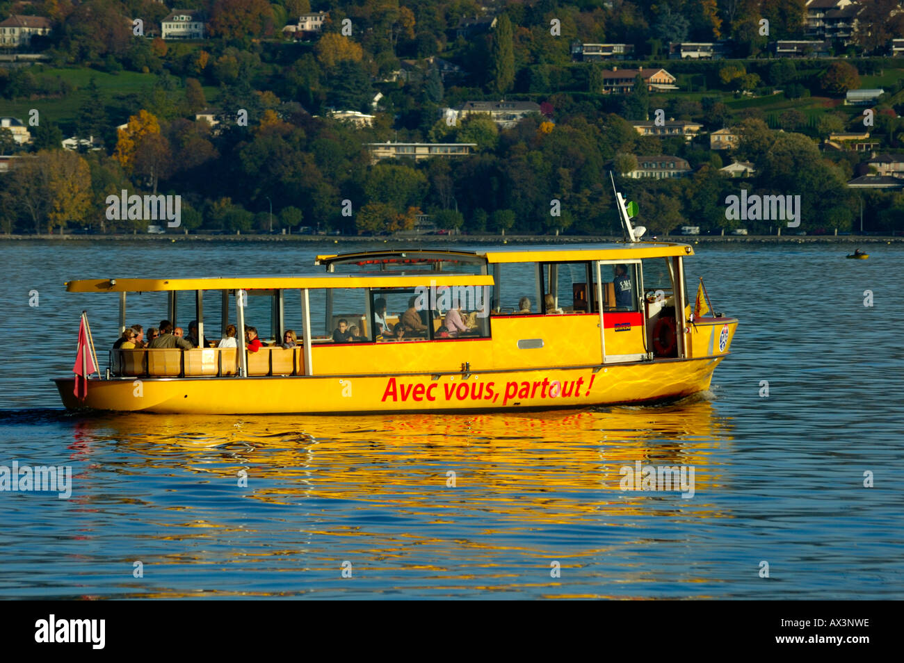 A Swiss solar-powered water bus, called a Mouette, grossing Lake Geneva ...