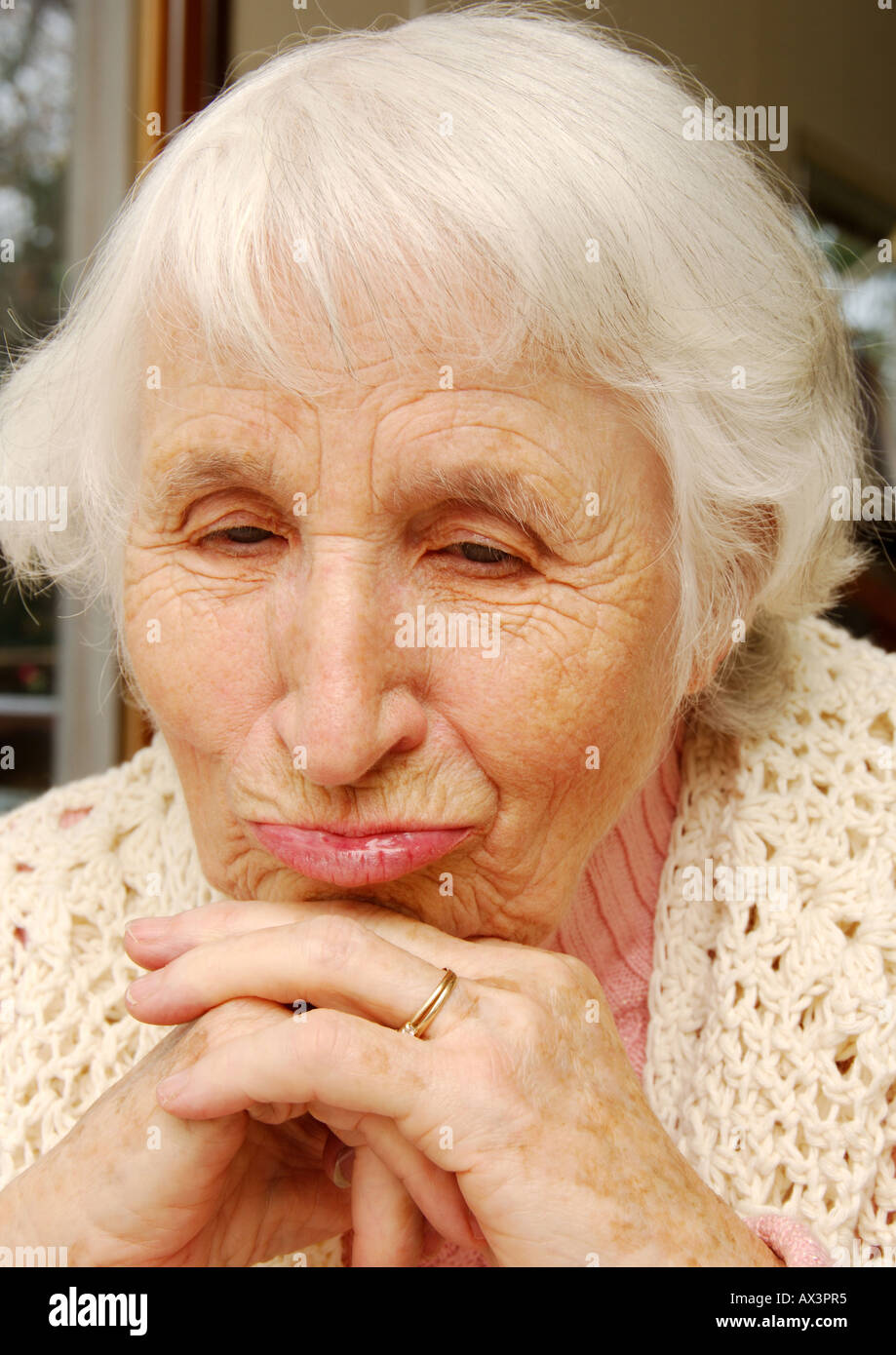 Portrait of an elderly woman pouting Stock Photo - Alamy