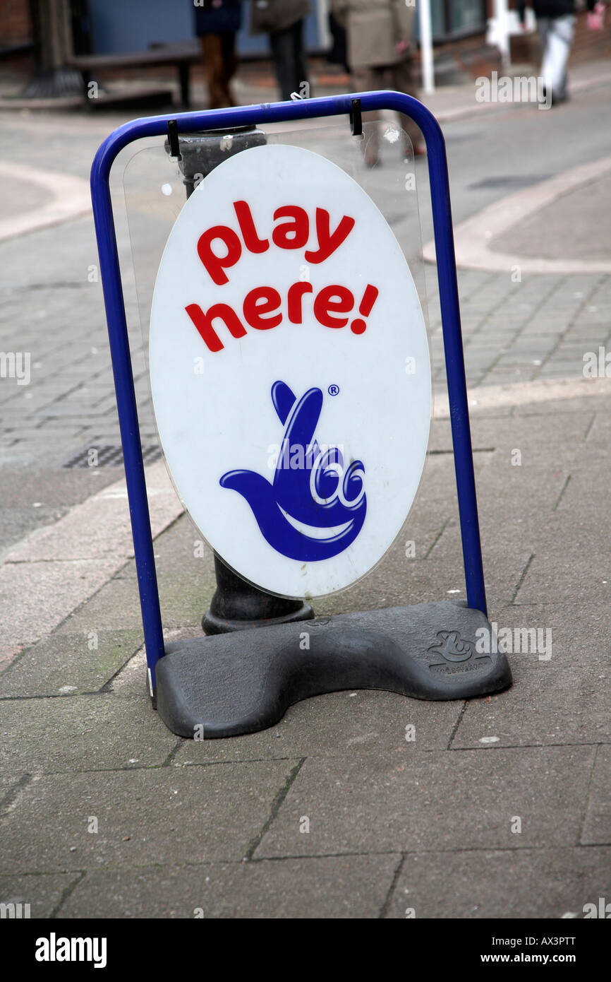 National lottery sign on pavement Stock Photo - Alamy