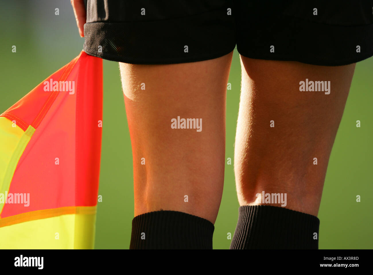 Female Assistant Referee with flag / Linesman at a football match Stock ...