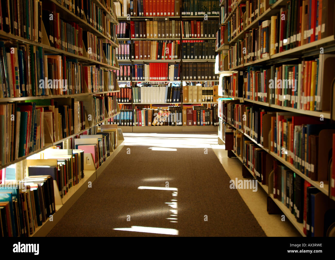 View of the bookshelves in a library Stock Photo - Alamy
