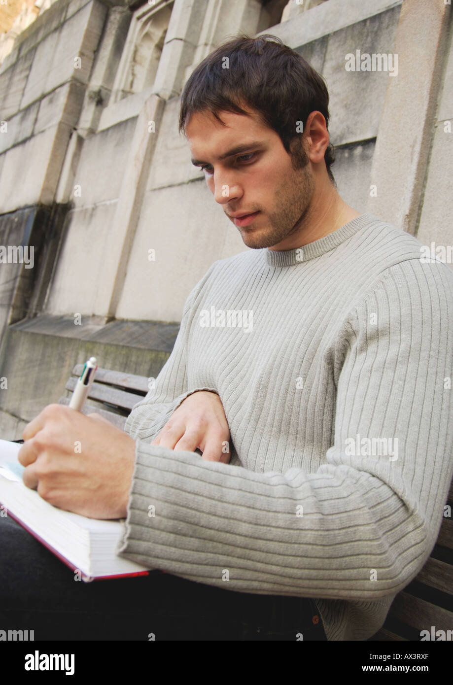 Portrait handsome student writing hi-res stock photography and images ...