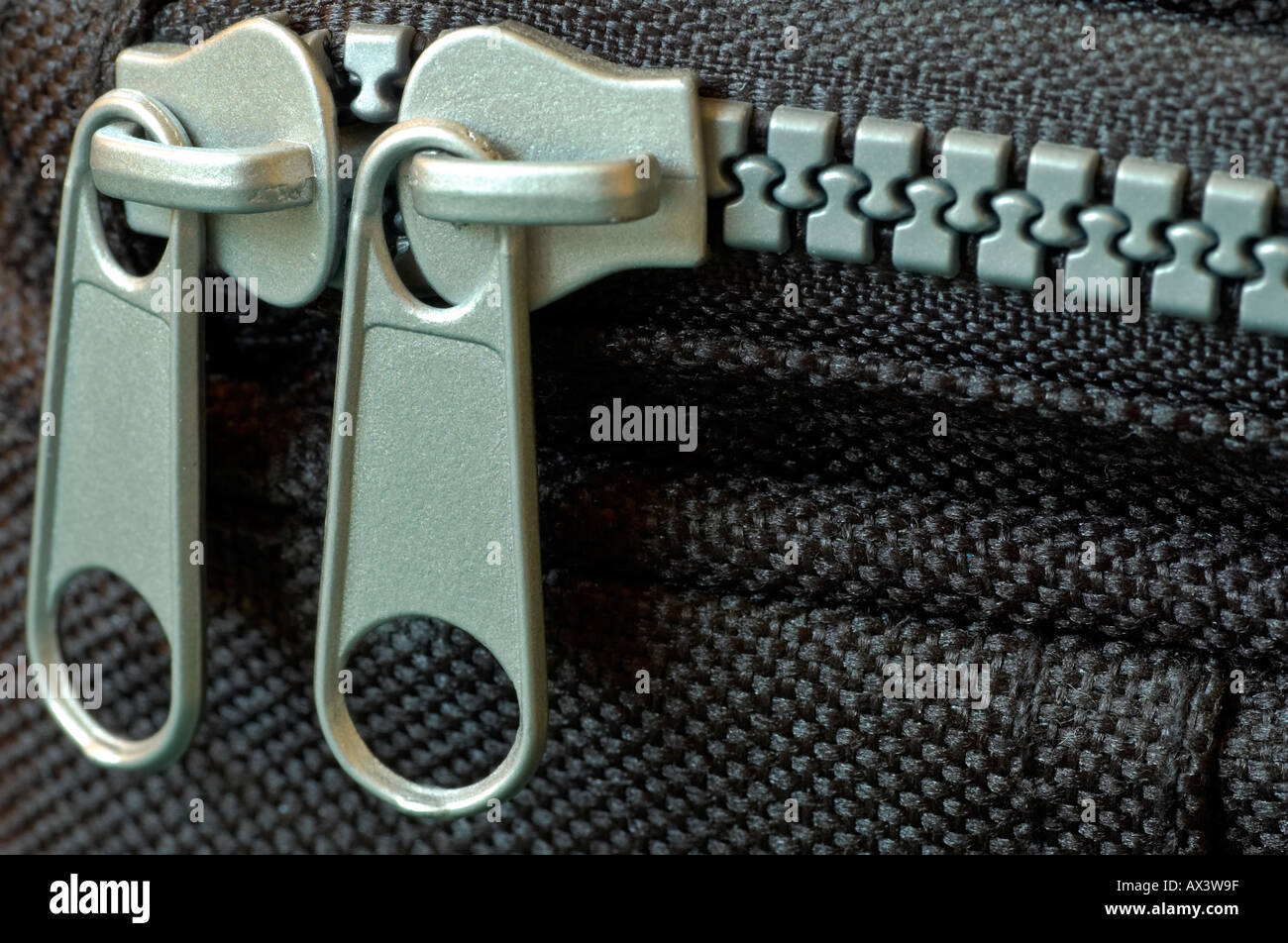 Detail of a two way zip fastner sewn into a heavy fabric Stock Photo ...