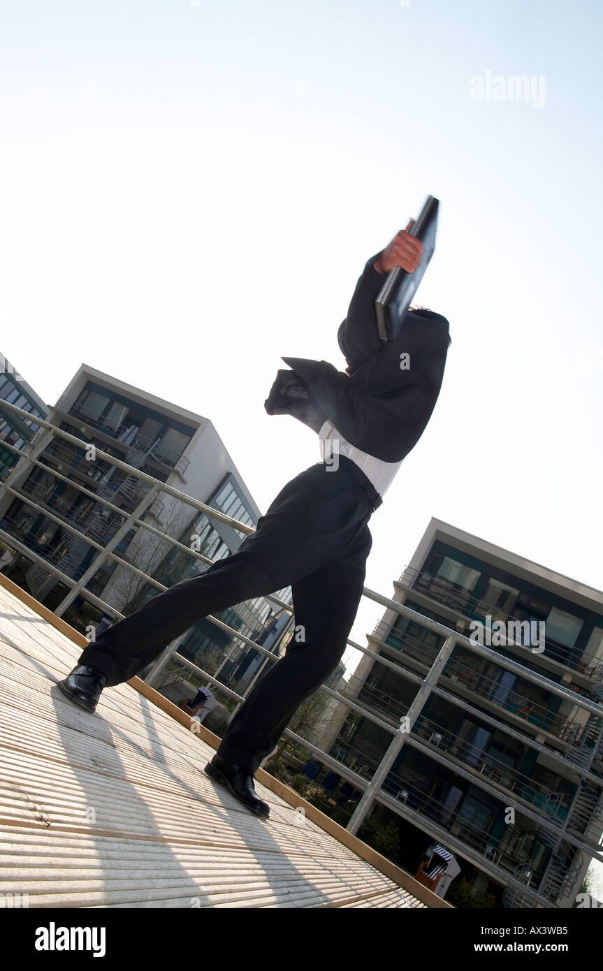 business man throwing away his notebook Stock Photo - Alamy