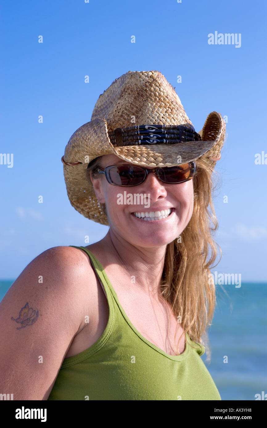 Woman Wearing Straw Hat Smiling High Resolution Stock Photography and ...