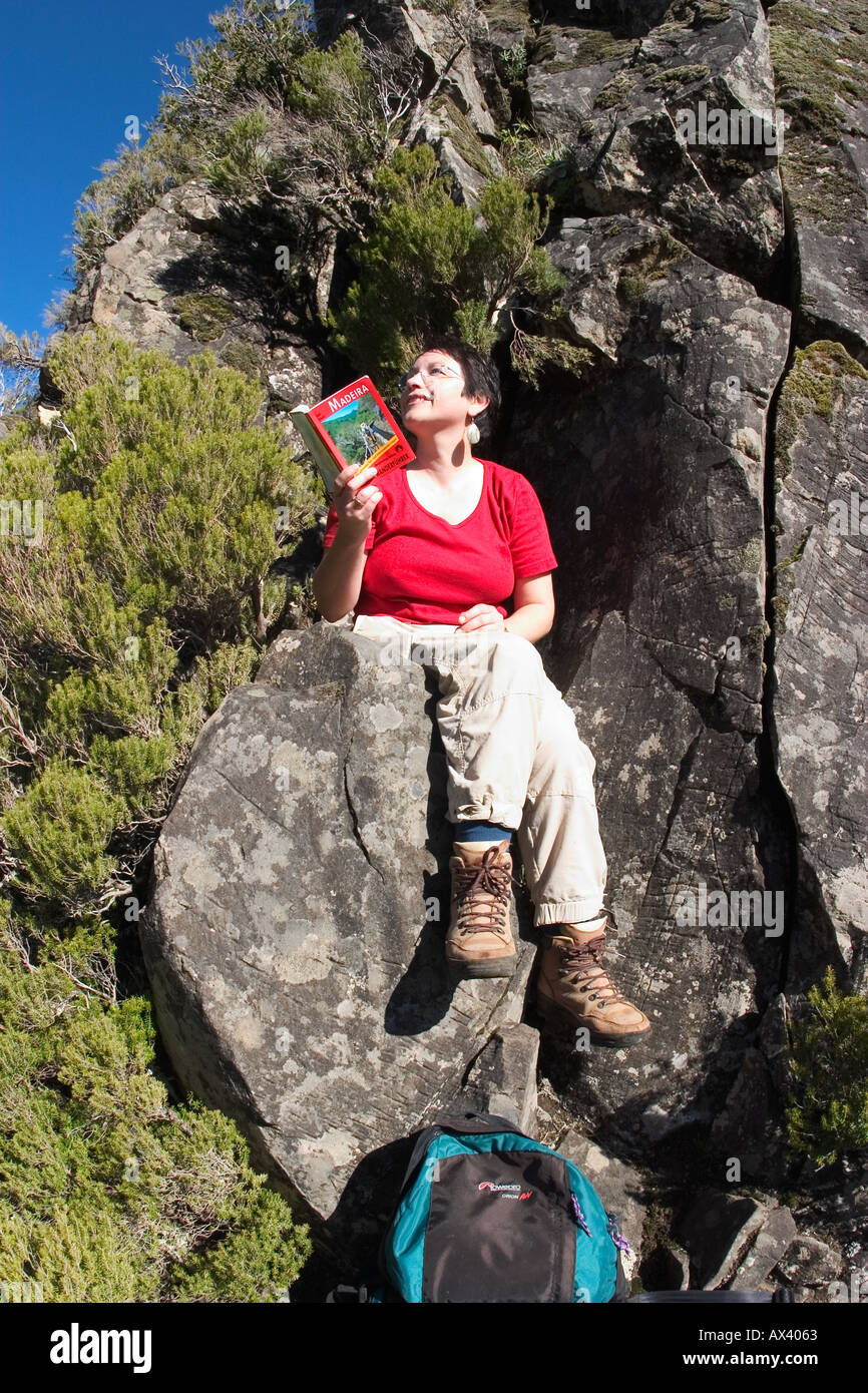 hiker look at guide at Pinaculo Madeira Stock Photo - Alamy