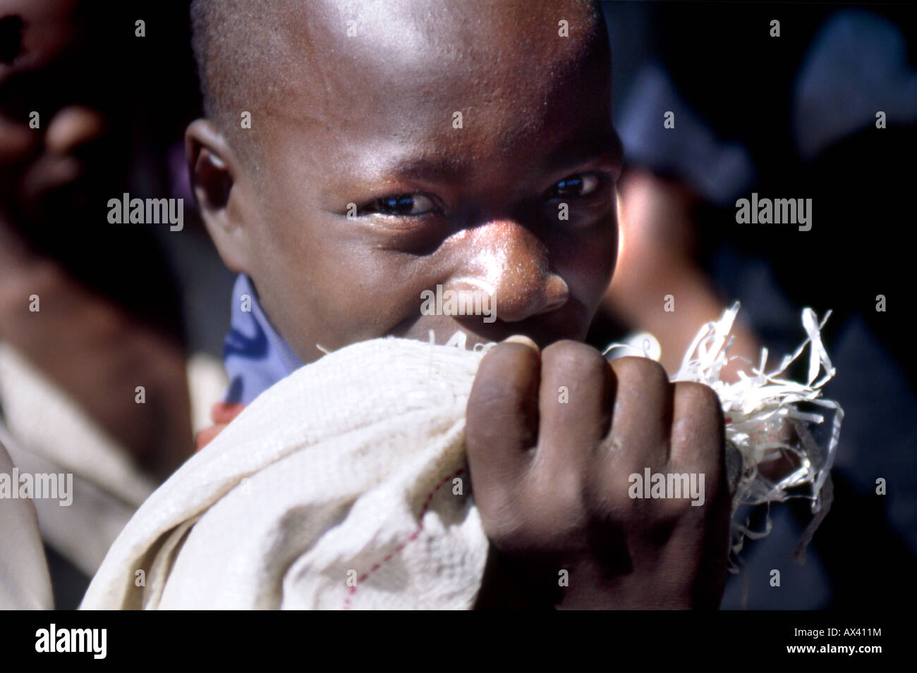 Refugee child from democratic republic of congo clutches a food bag at ...
