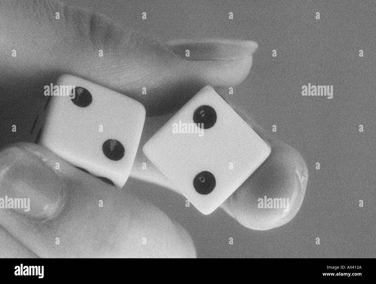 Hand with dice Black and White Stock Photos & Images - Alamy