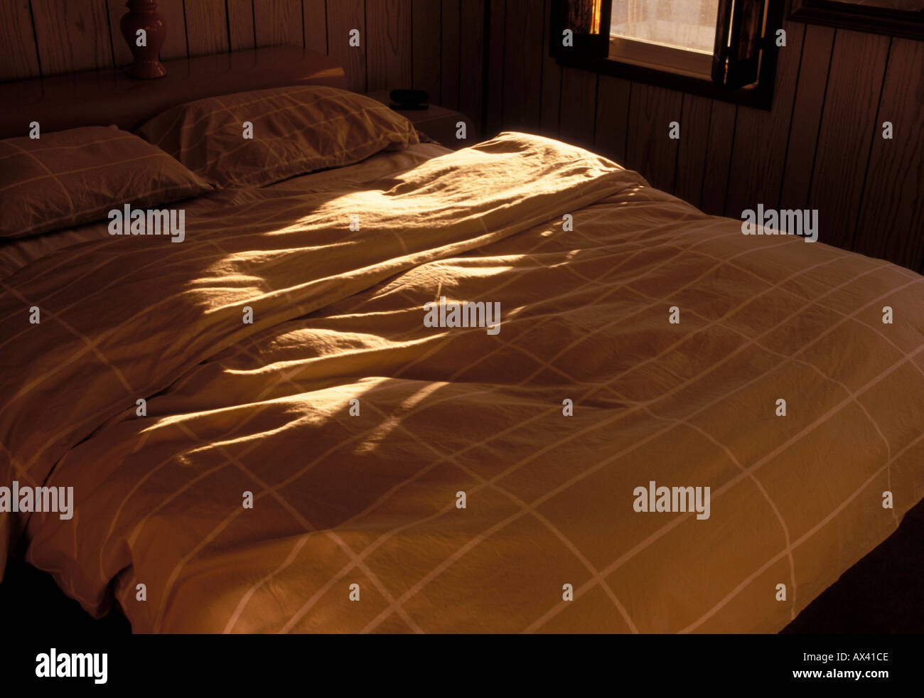 Before and after 120c Light on bed QHTK1183 Stock Photo - Alamy