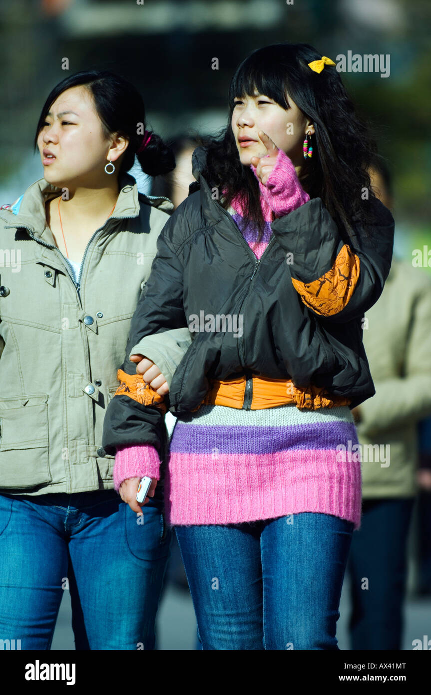 China, Beijing. Chinese girls walking on Wanfujing Shopping street ...