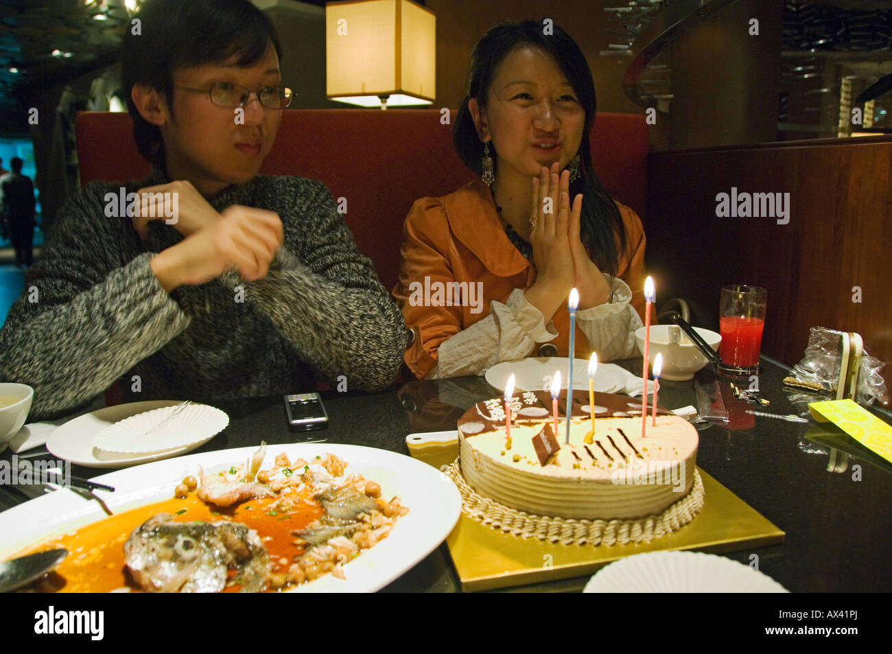 China, Beijing. Birthday celebrations at a Chinese fish restaurant in ...