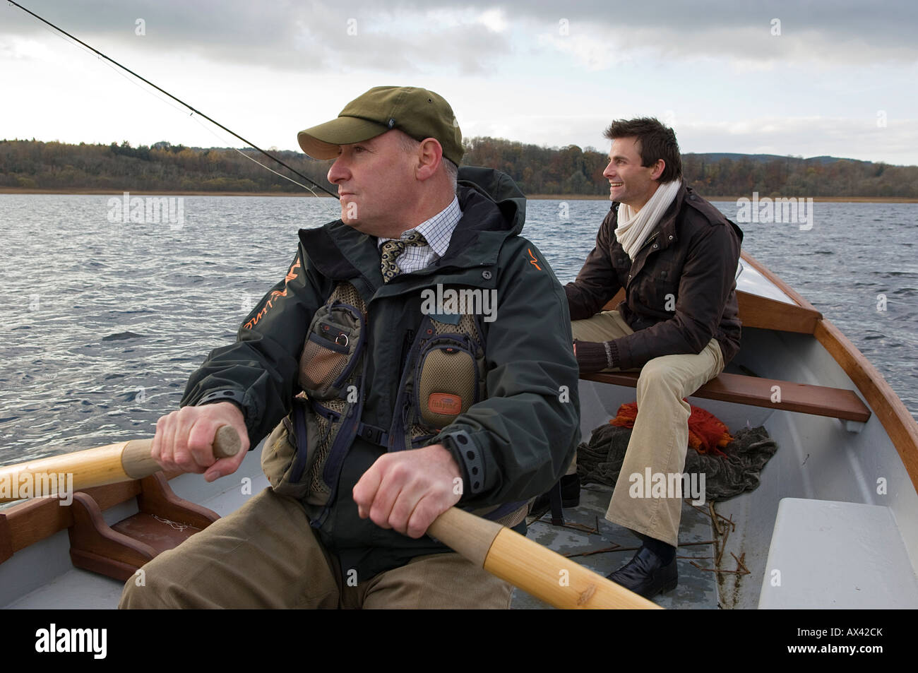 UK, Northern Ireland, Fermanagh. Fly fishing for trout from a boat on ...