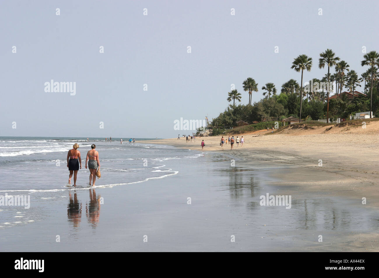 The Gambia Fajara people walking along the beach Stock Photo - Alamy