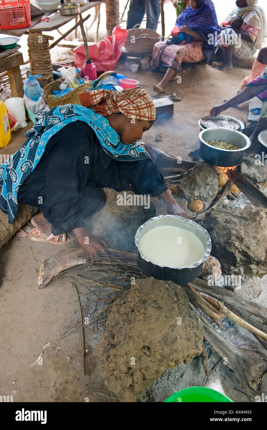 Zanzibar native woman cook the food in a village of the interland Stock ...