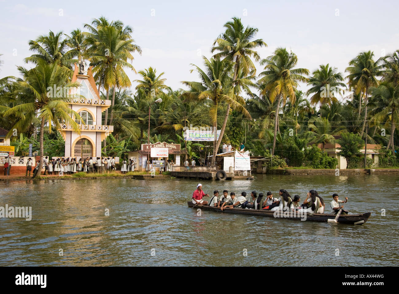 School students commuting in a canoe, Kuttamangalam, Kainakary village ...