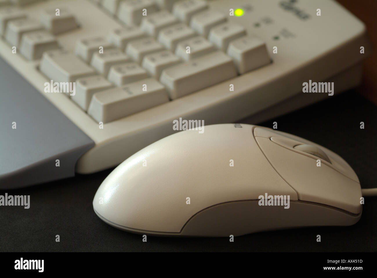 Computer Mouse Next to a keyboard Stock Photo - Alamy