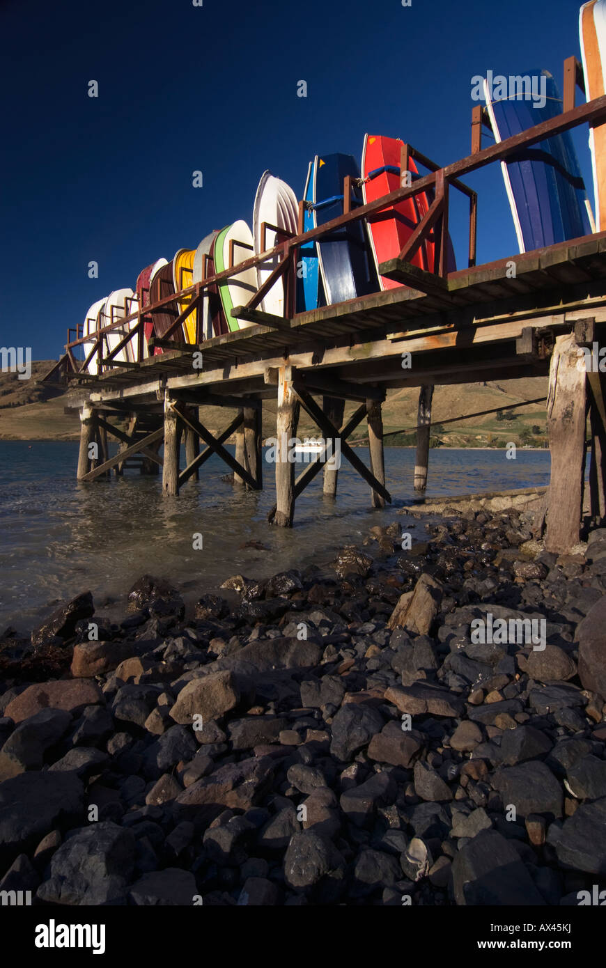 Colourful dinghys on a jetty in Lyttelton Harbour, New Zealand Stock ...