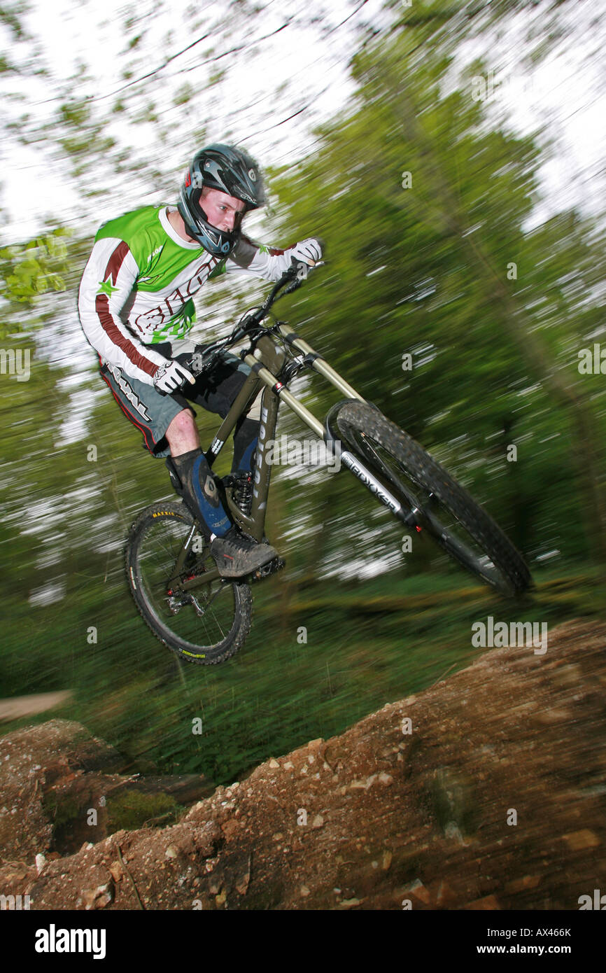 A mountain biker jumping a downhill mountainbike Stock Photo - Alamy