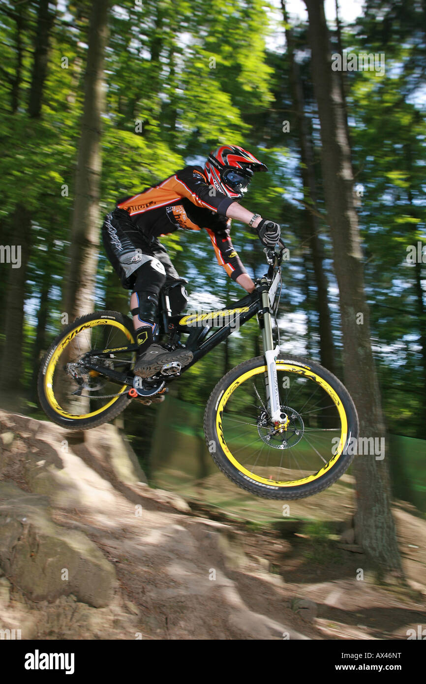 A male mountain biker riding a downhill mountainbike Stock Photo - Alamy