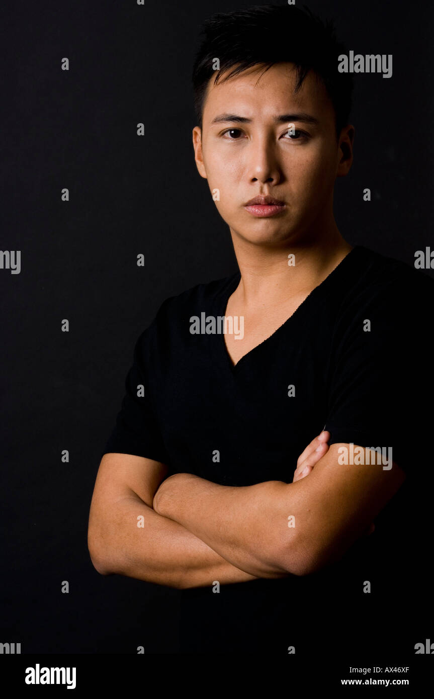 A moody portrait of a young chinese male model Stock Photo - Alamy