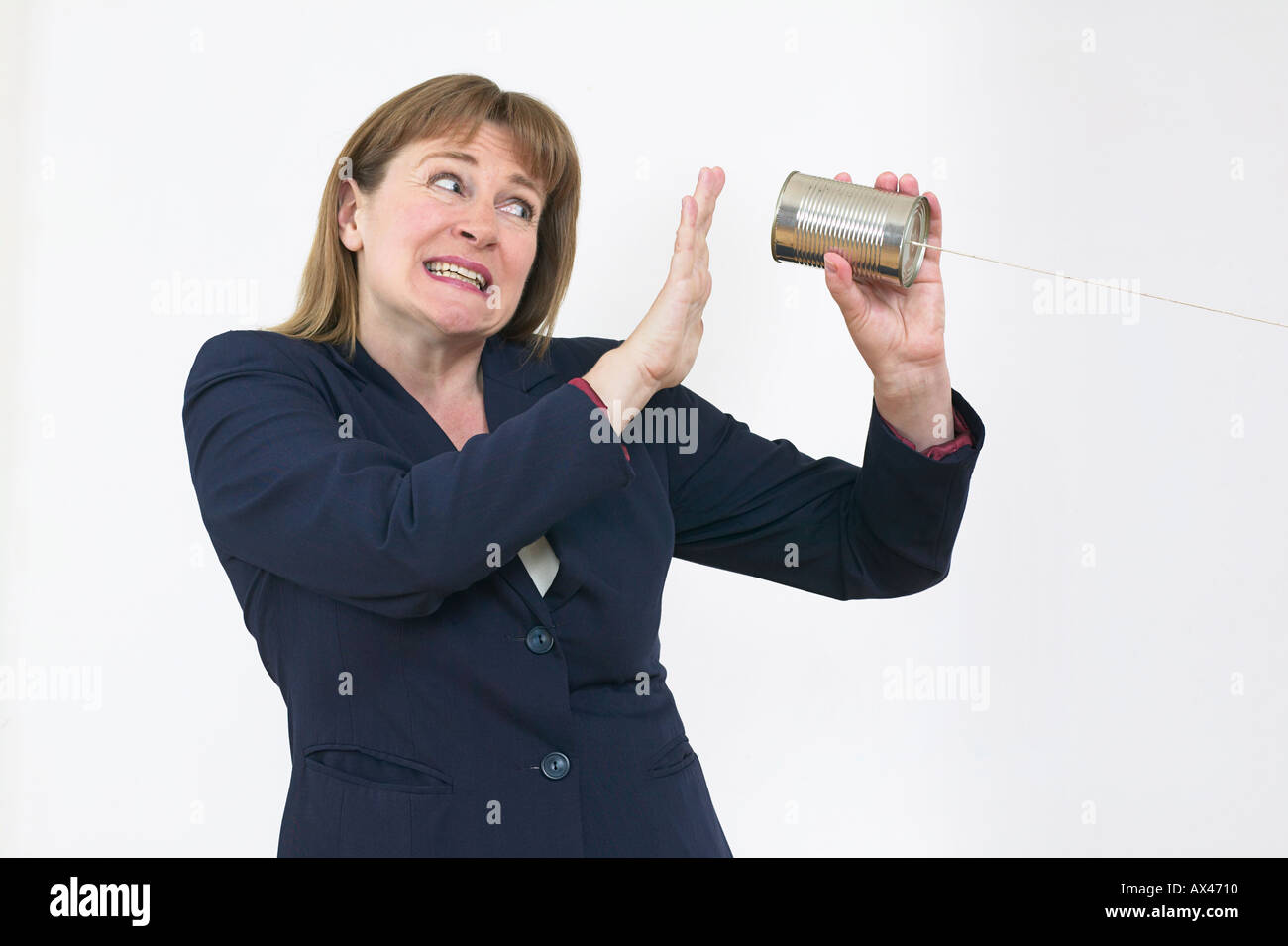 business woman speaks and listens having conversation on tin can and ...