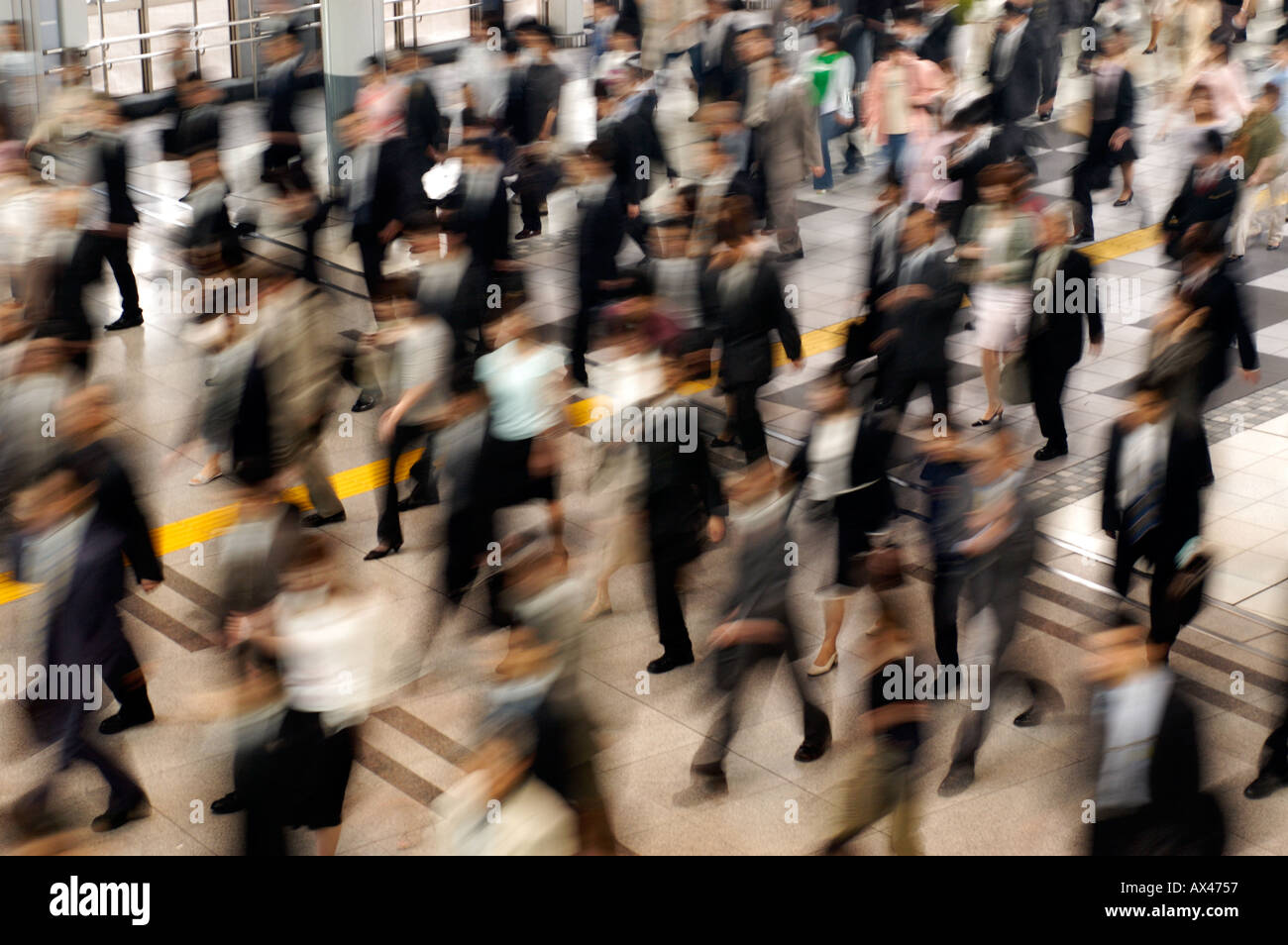 Morning rush hour commuters walk through Shinagawa Station in Tokyo ...