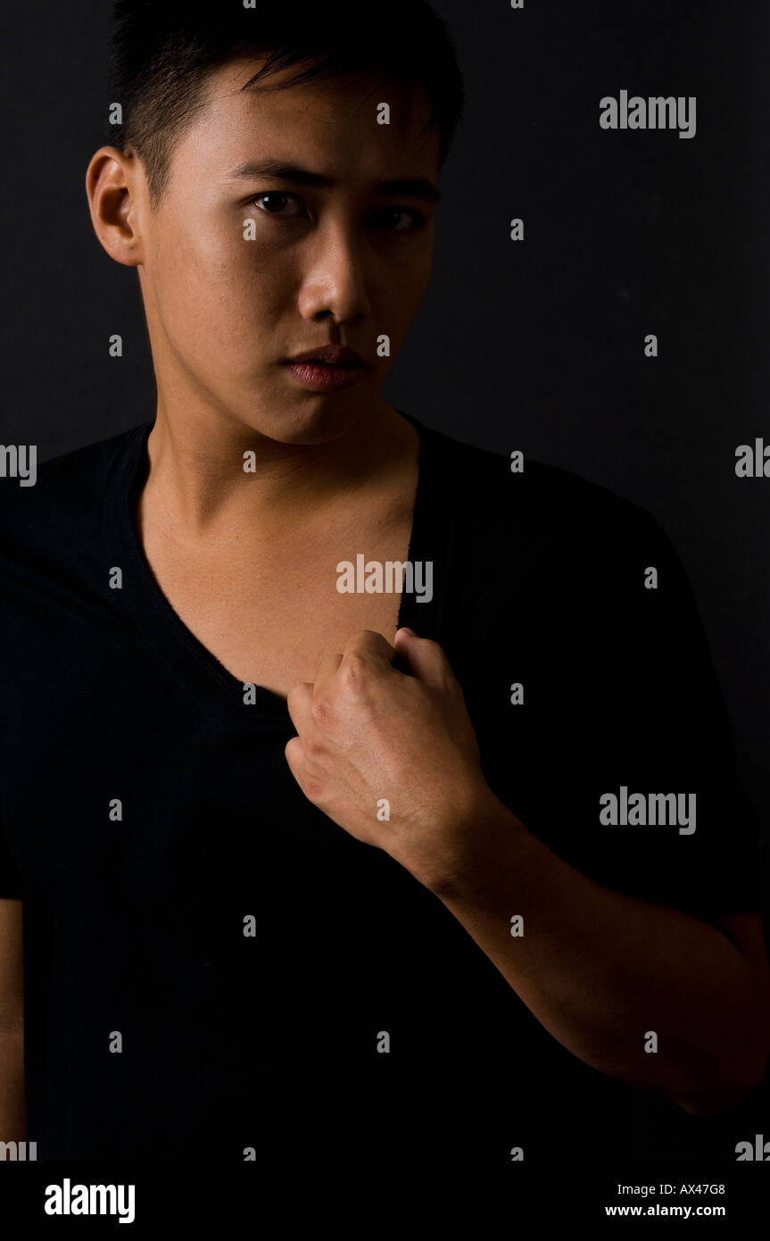 A chinese male model in black on black Stock Photo - Alamy
