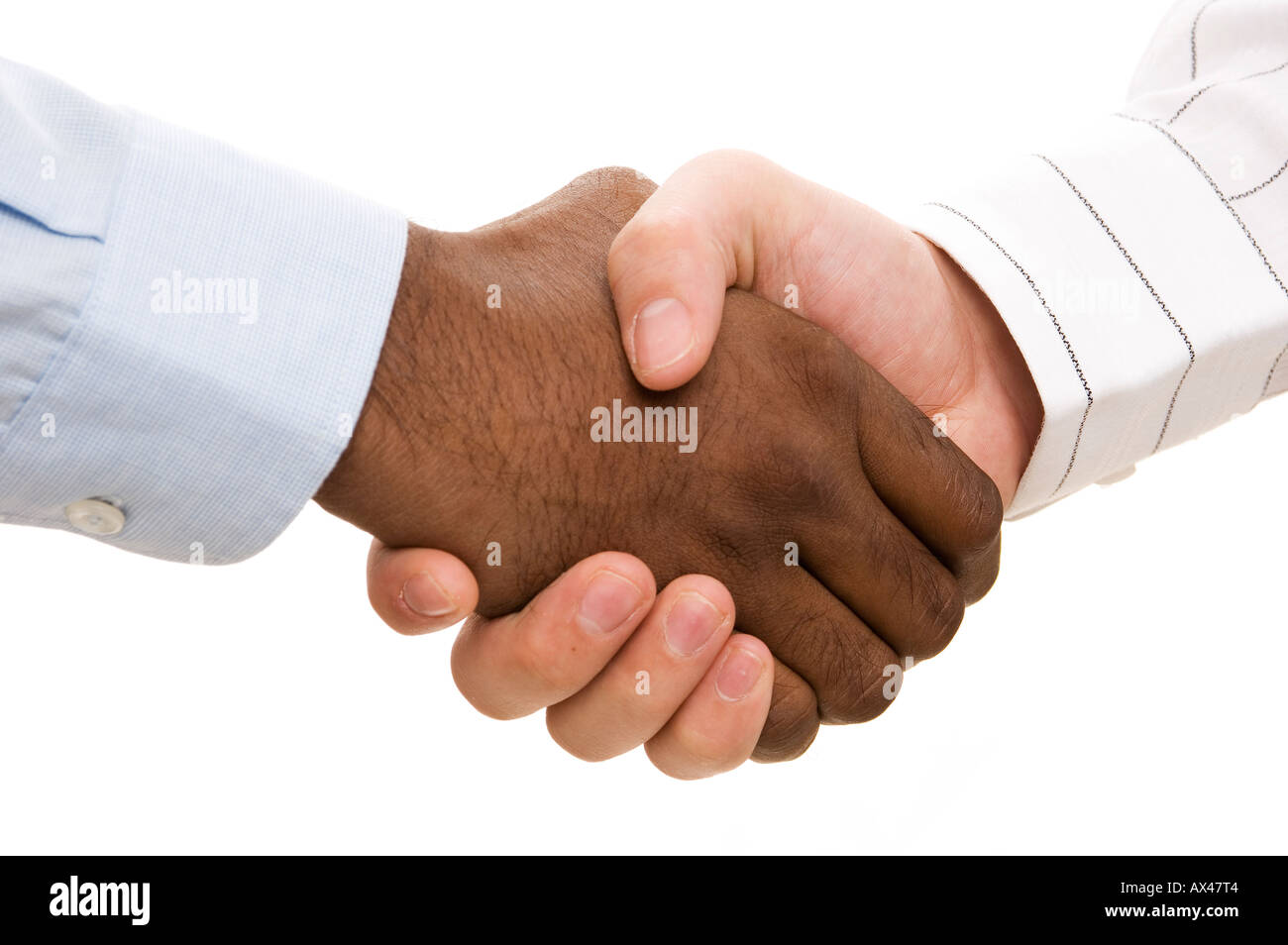 A close up of two hands different races shaking Stock Photo - Alamy