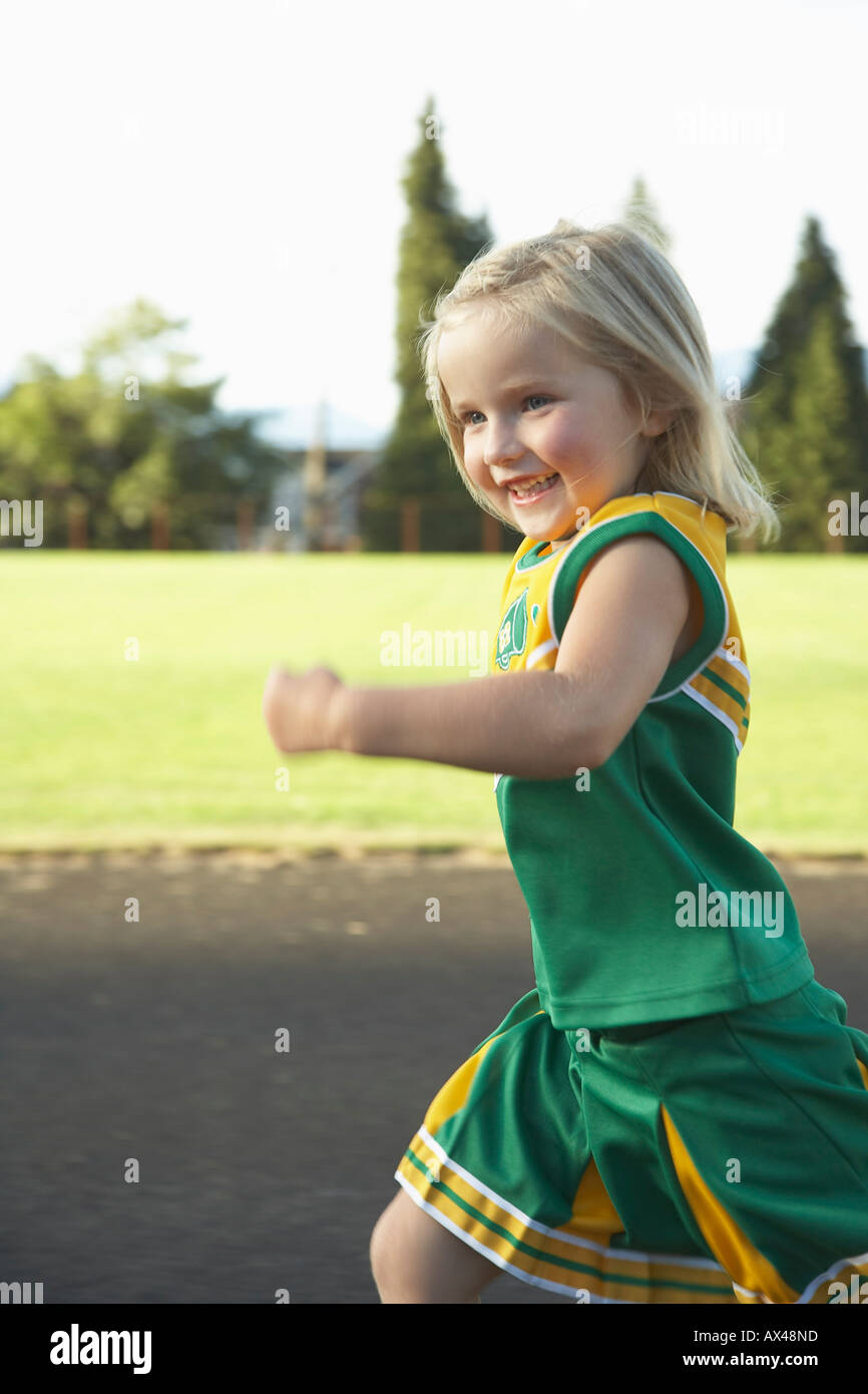 Girl Dressed as Cheerleader Running Stock Photo - Alamy